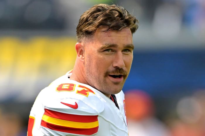 Beaming Travis Kelce shows off slick new hairstyle as he steps out in New York City without ...