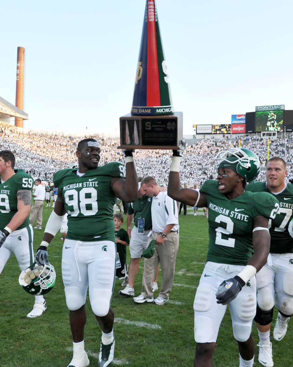 Fascinating College Football Rivalry Trophies Fans Might Not Know ...